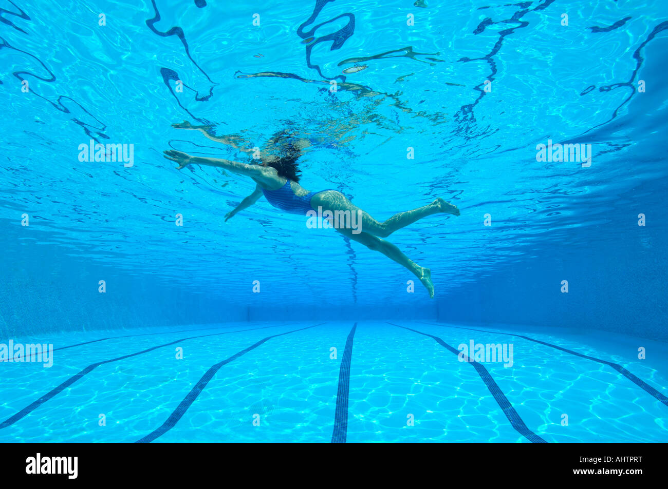 Woman swimming in pool, underwater view Stock Photo - Alamy