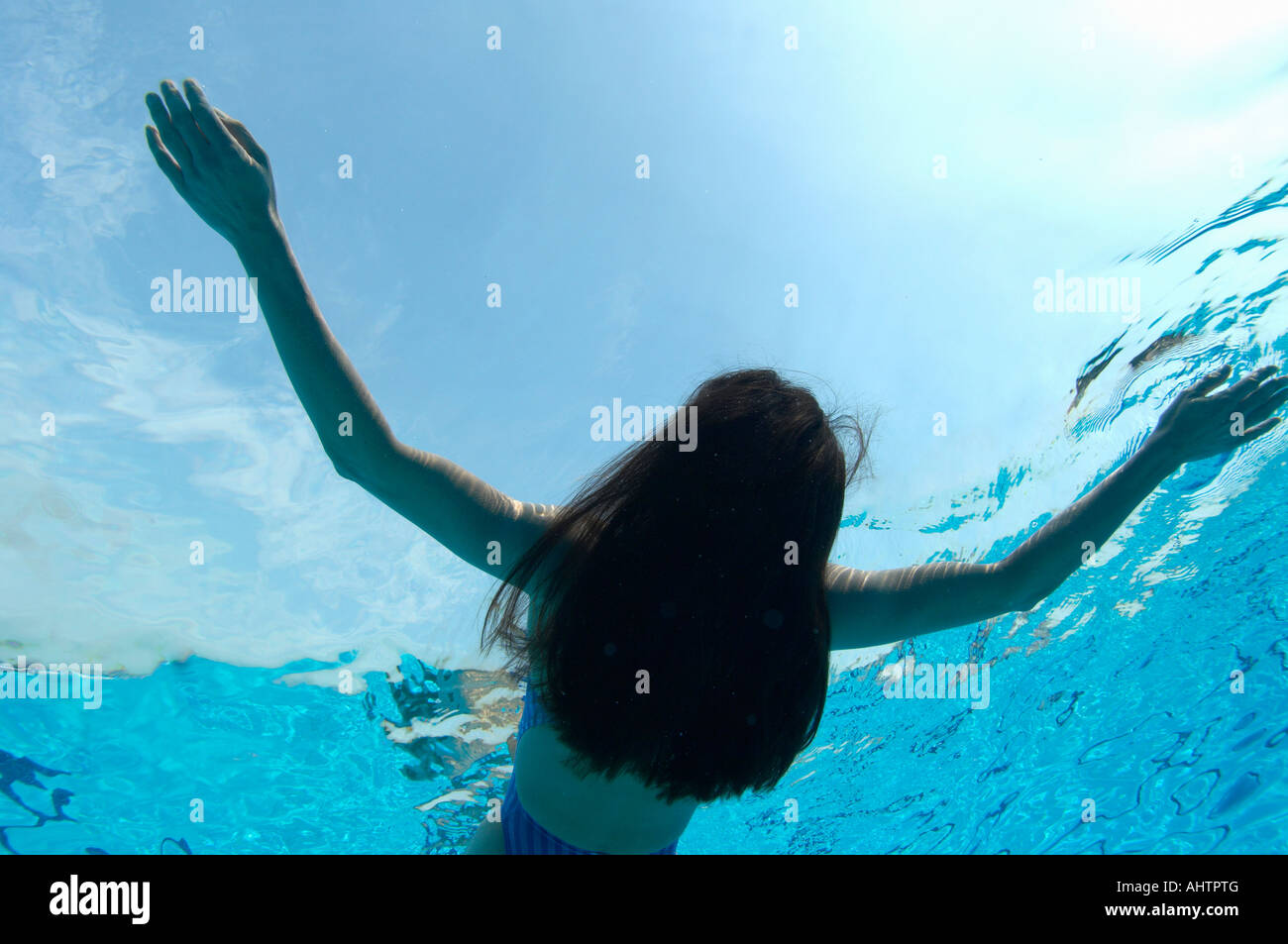 Woman floating in swimming pool, underwater view Stock Photo - Alamy