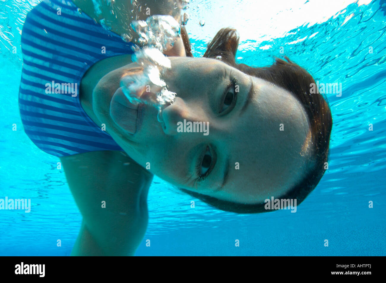 Female swimmer pulling face, portrait, underwater view Stock Photo - Alamy