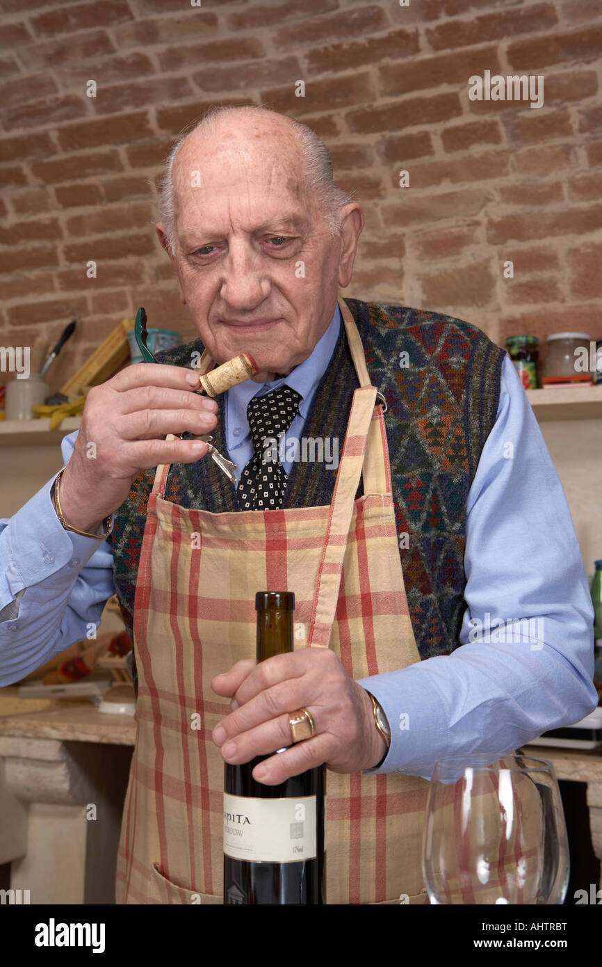 Senior man sniffing wine cork Stock Photo - Alamy