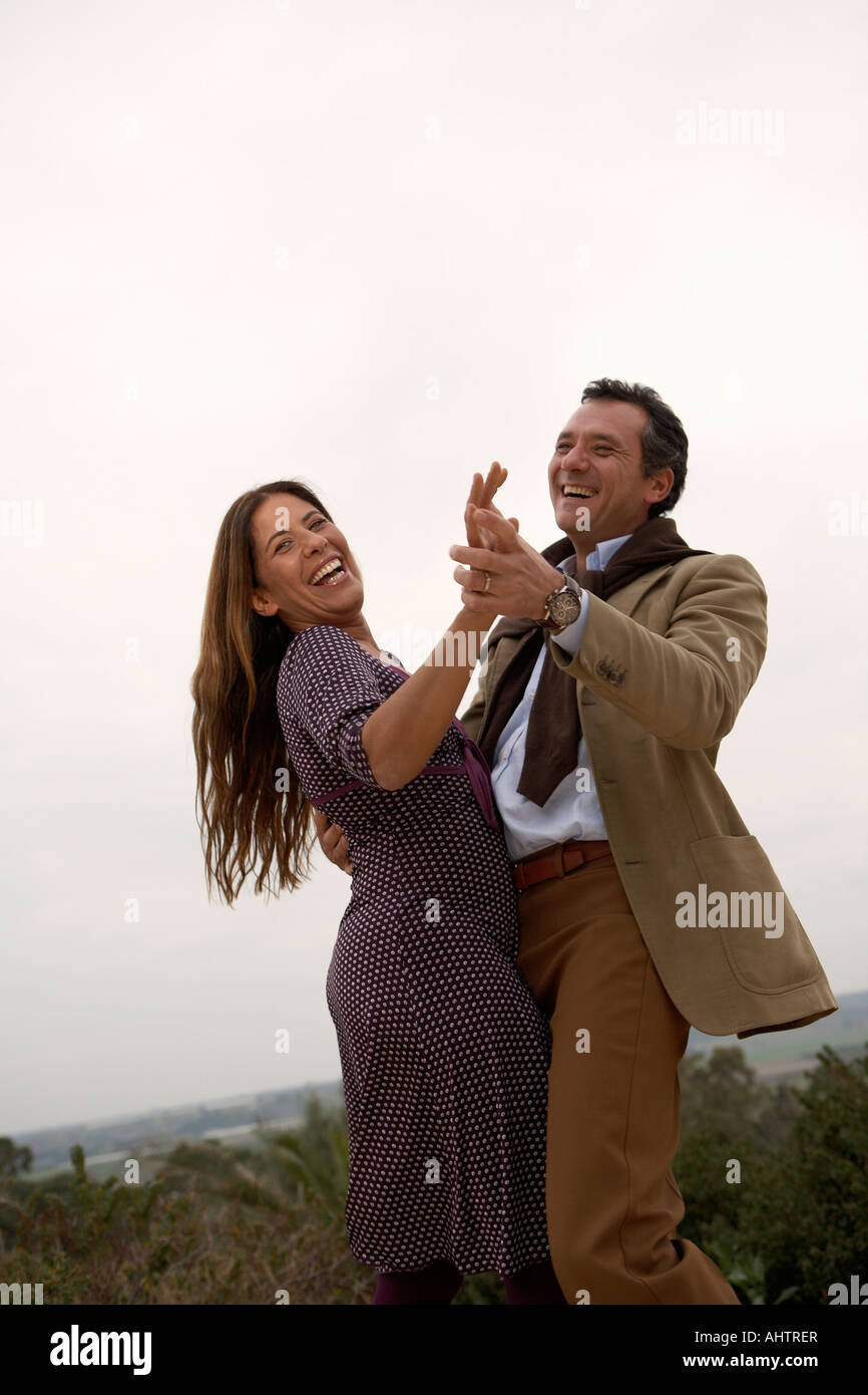 Couple dancing outside Stock Photo - Alamy