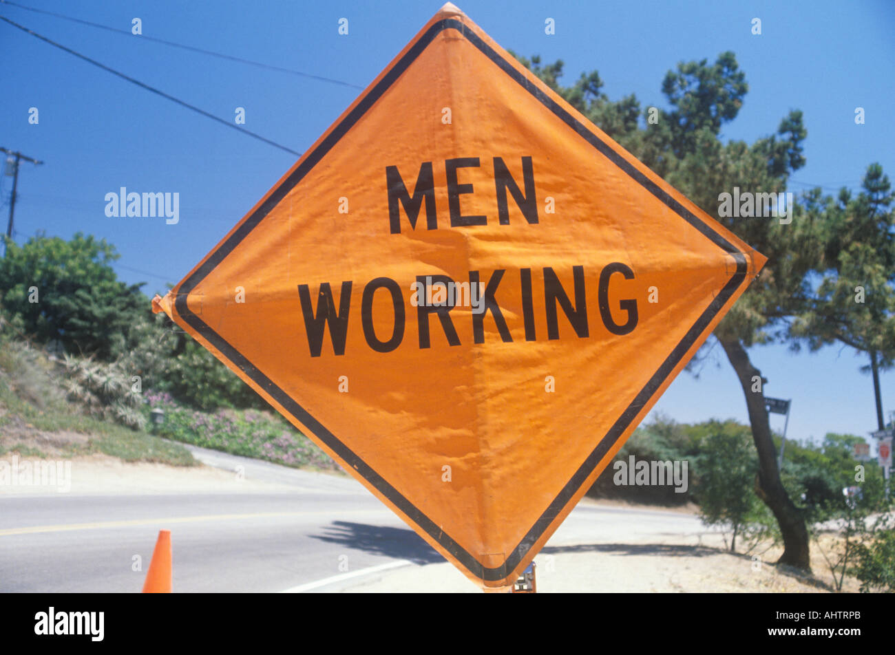 Men working road sign hi-res stock photography and images - Alamy