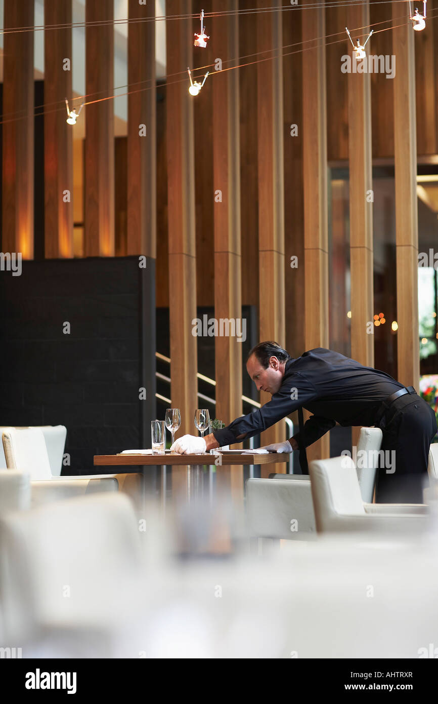 Waiter getting table ready hi-res stock photography and images - Alamy