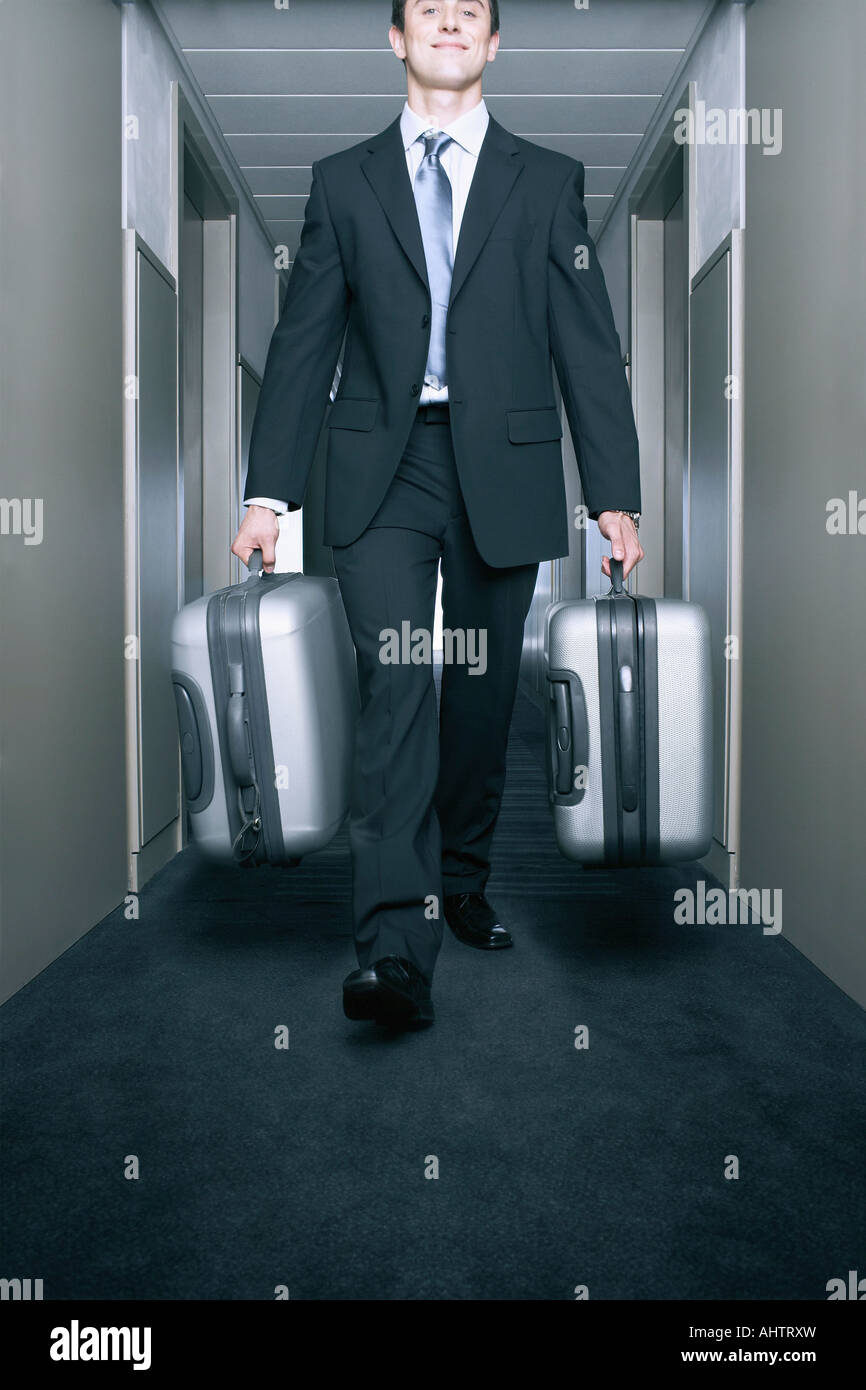 Man with suitcases case hi-res stock photography and images - Alamy