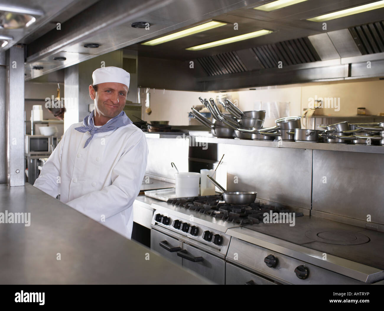 Chef preparing food in his kitchen Stock Photo - Alamy