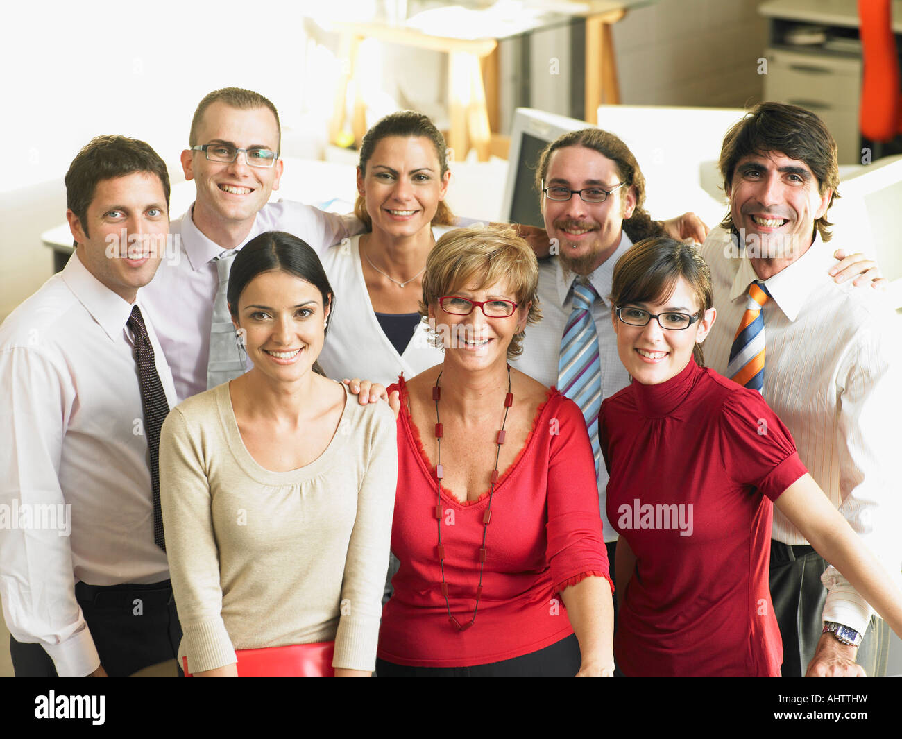 Staff standing together in a group Stock Photo - Alamy