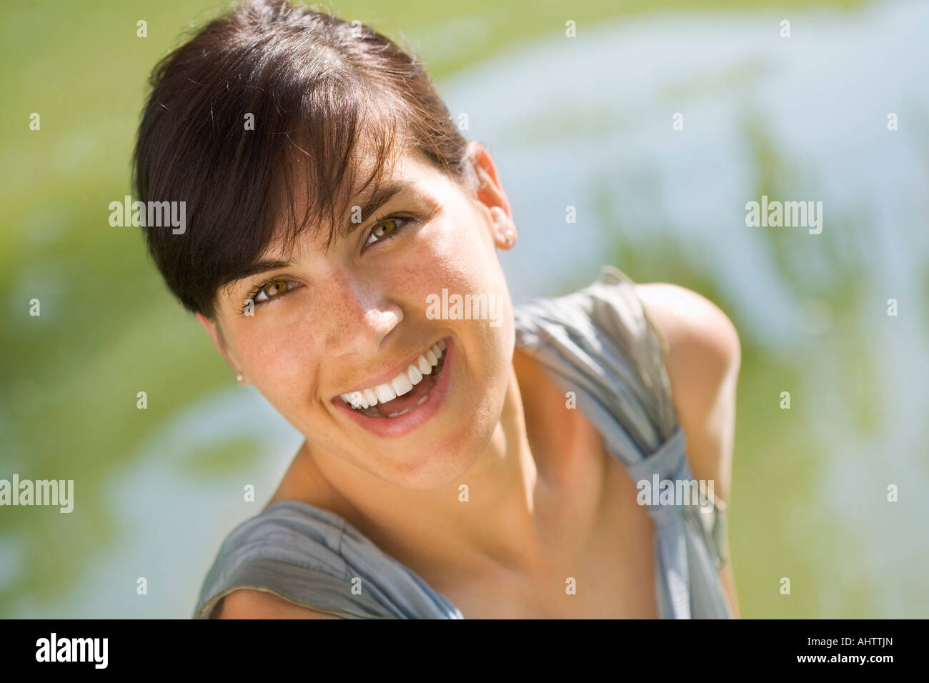 Woman smiling outdoors Stock Photo - Alamy