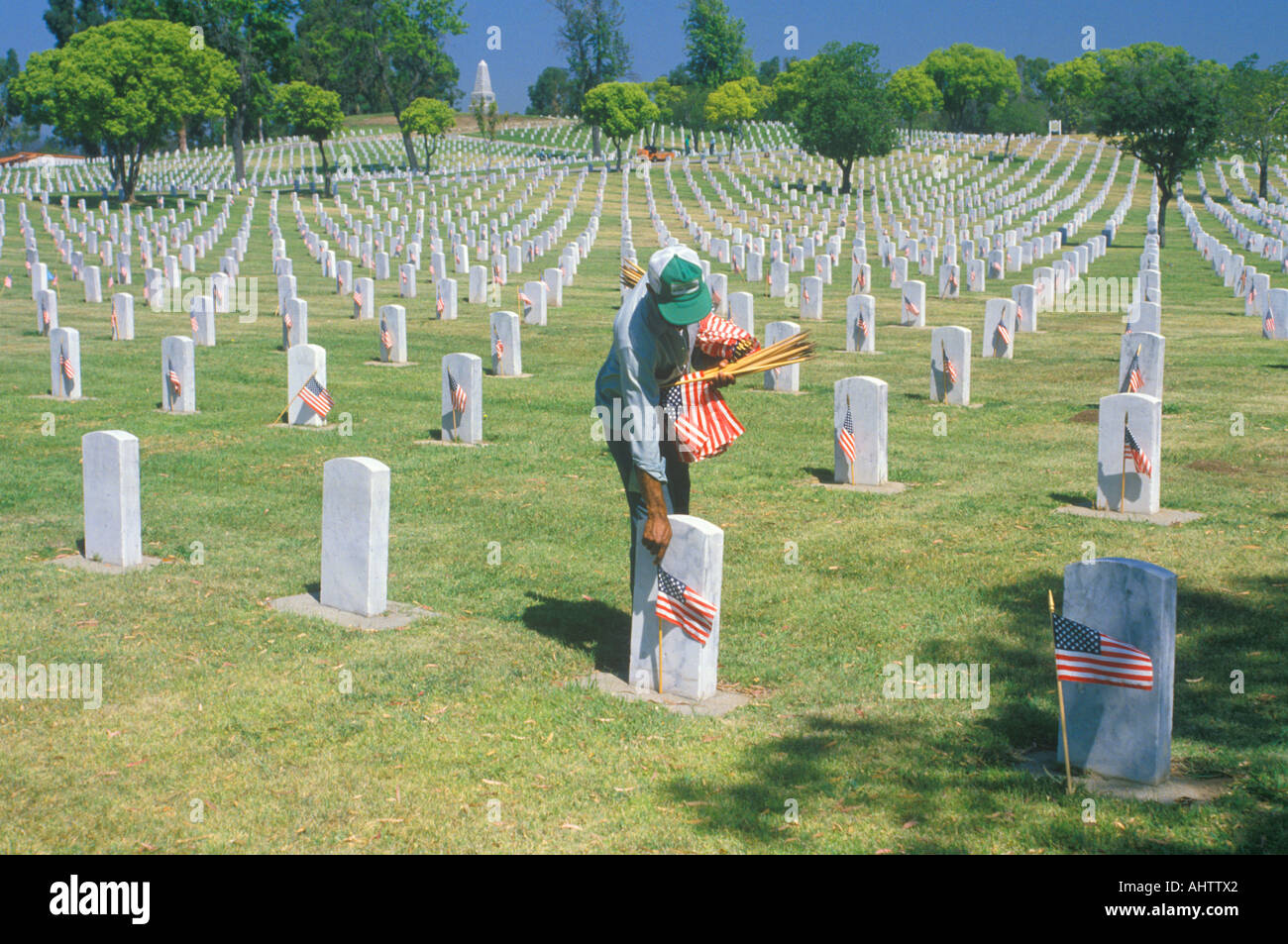 Man Placing Flags at Graves Los Angeles California Stock Photo - Alamy