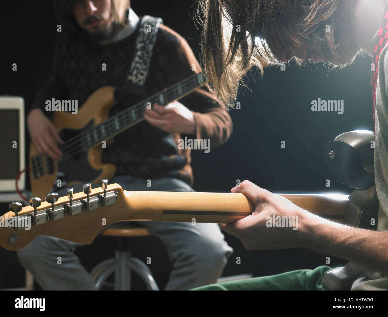 Two electric guitar players Stock Photo - Alamy