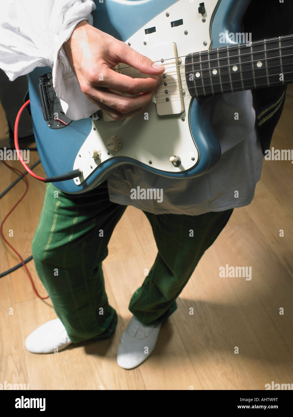 One electric guitar player close up on hand in studio Stock Photo - Alamy