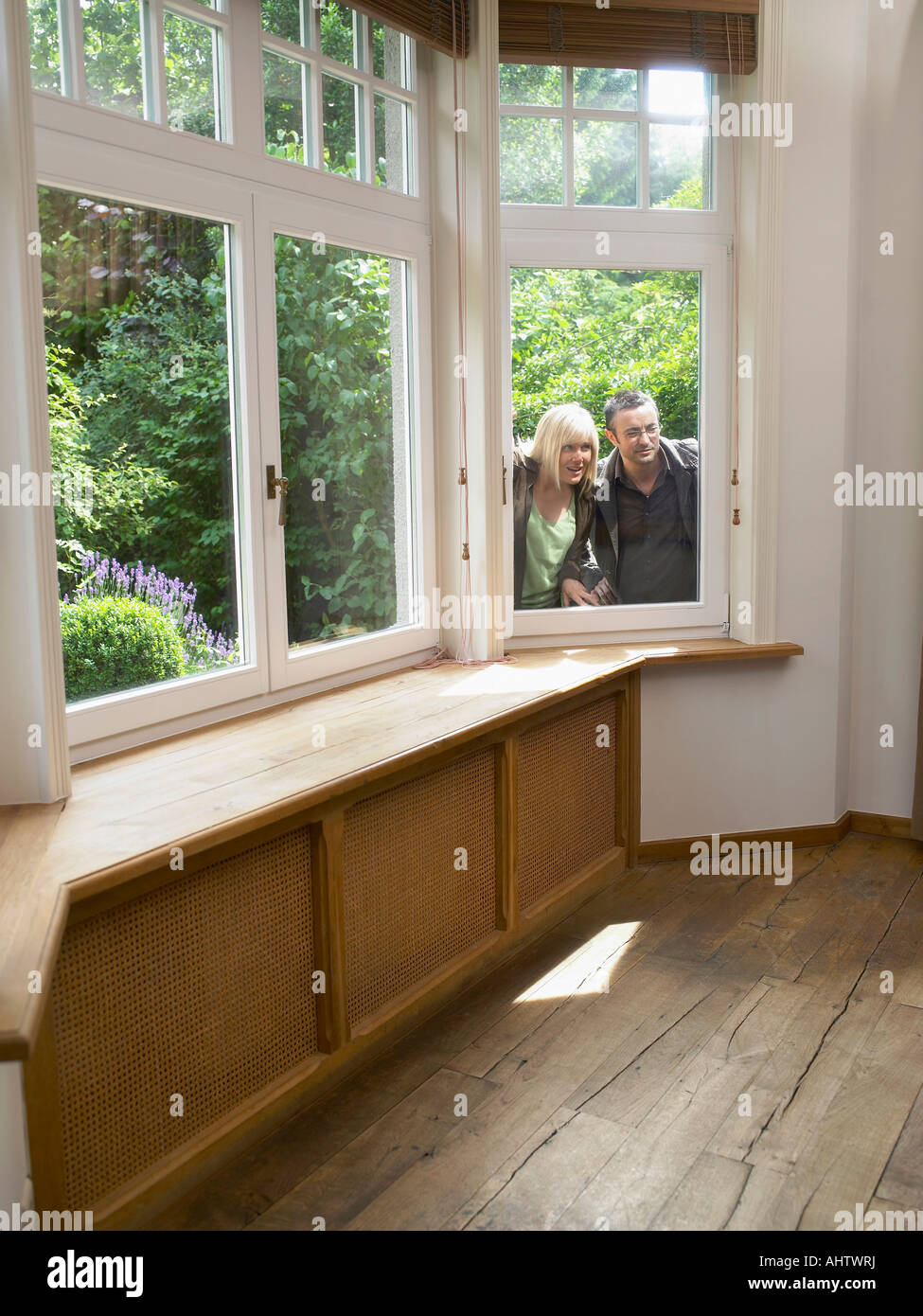 Caucasian couple looking through images hi-res stock photography and ...