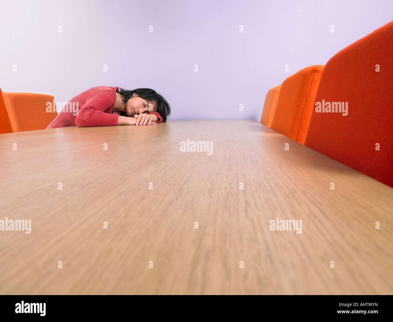 Sleeping businesswoman at meeting table Stock Photo - Alamy