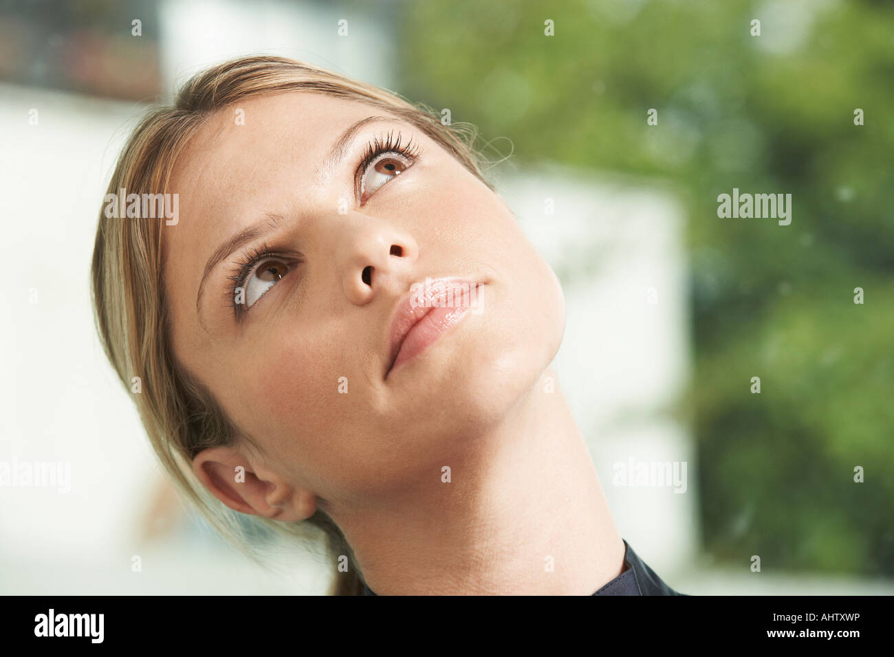 One woman looking upward close up hi-res stock photography and images ...