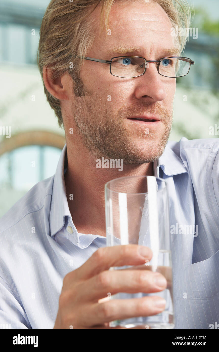 Close-Up portrait of Businessman drinking glass of water Stock Photo ...