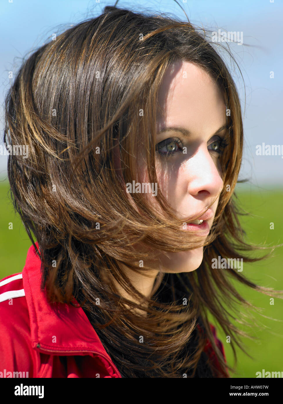 Woman outdoors looking out at something Stock Photo - Alamy