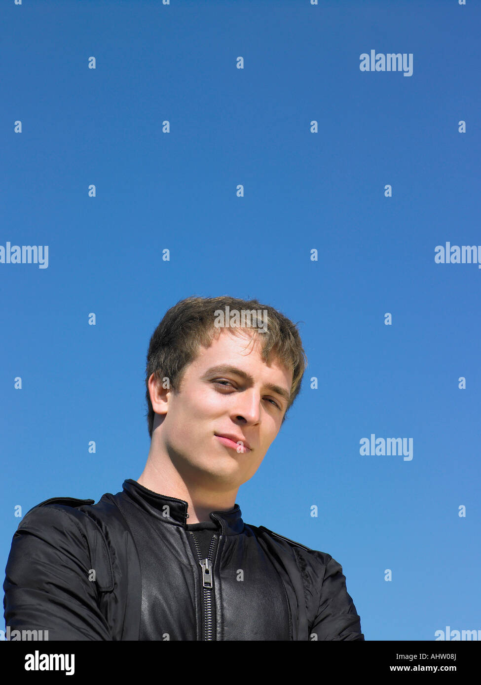 Young man looking at camera Stock Photo - Alamy