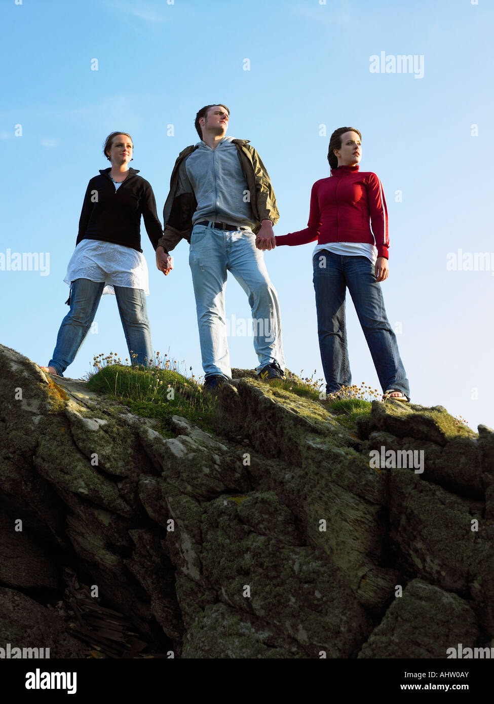 Three young people outdoors Stock Photo - Alamy