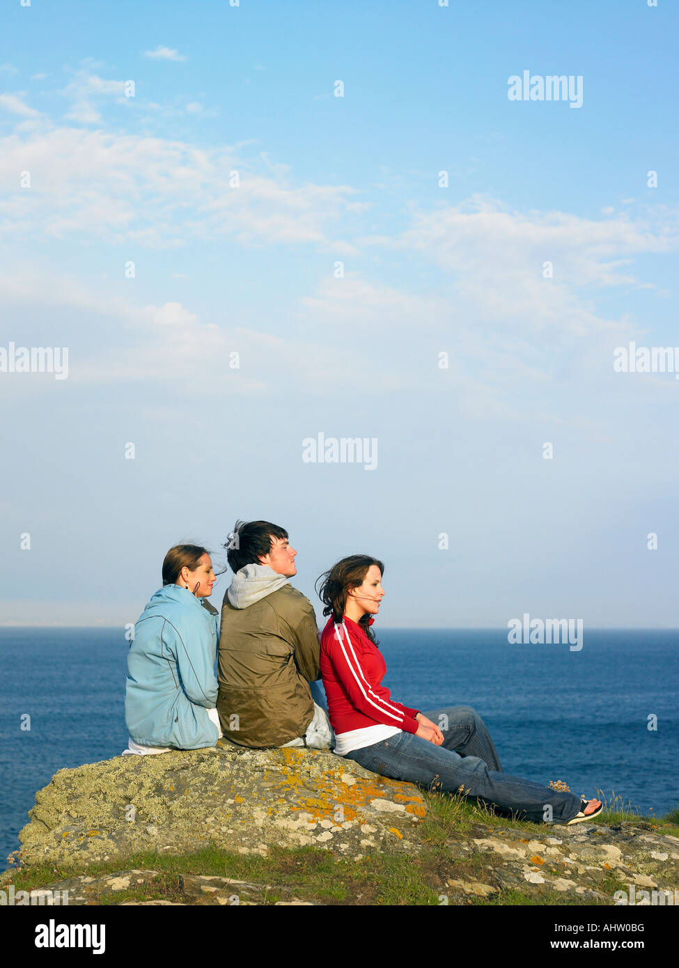 Three young people outdoors Stock Photo - Alamy
