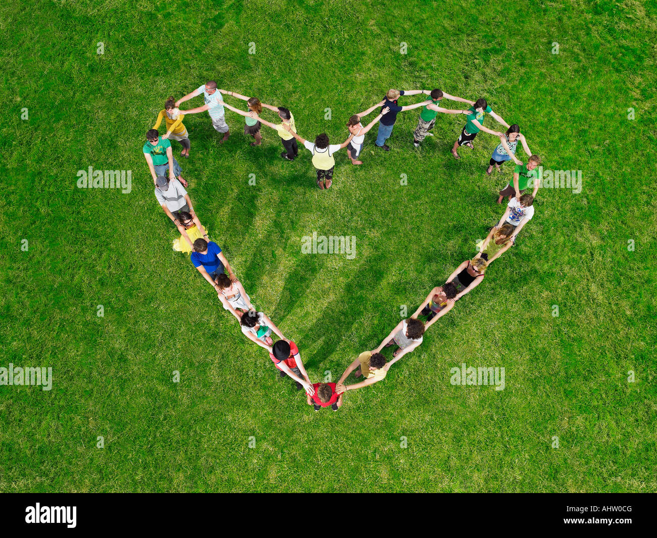 Group in heart shape formation Stock Photo - Alamy