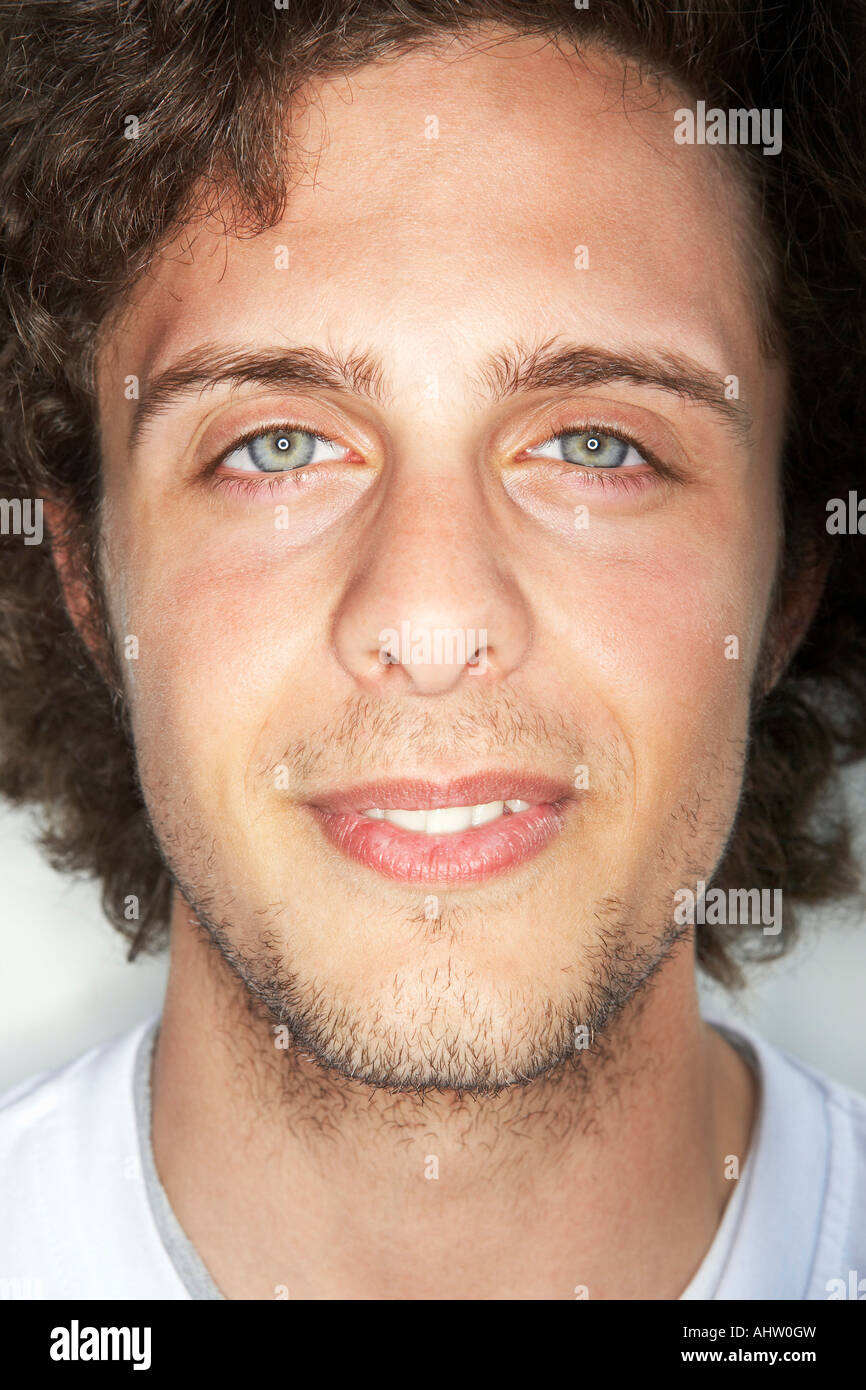 Male smiling and looking at camera Stock Photo - Alamy