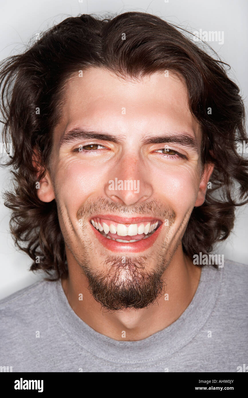 Young Male With Long Hair Smiling Stock Photo Alamy