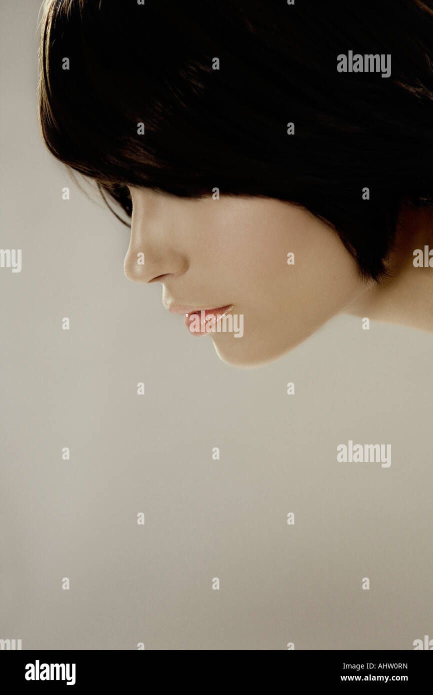 Woman looking down Stock Photo - Alamy