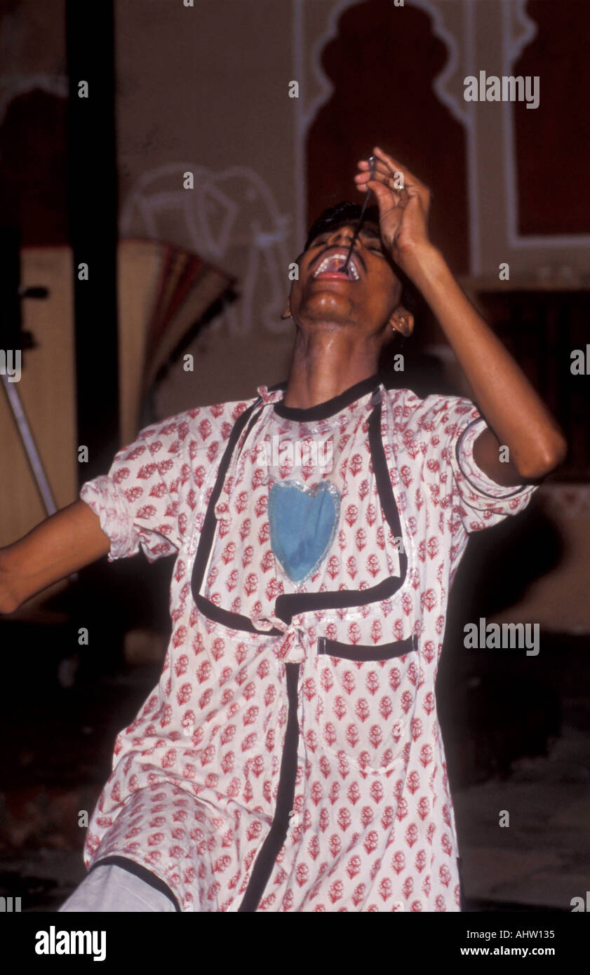 Indian dancing male performs a traditional dance routine with fire ...