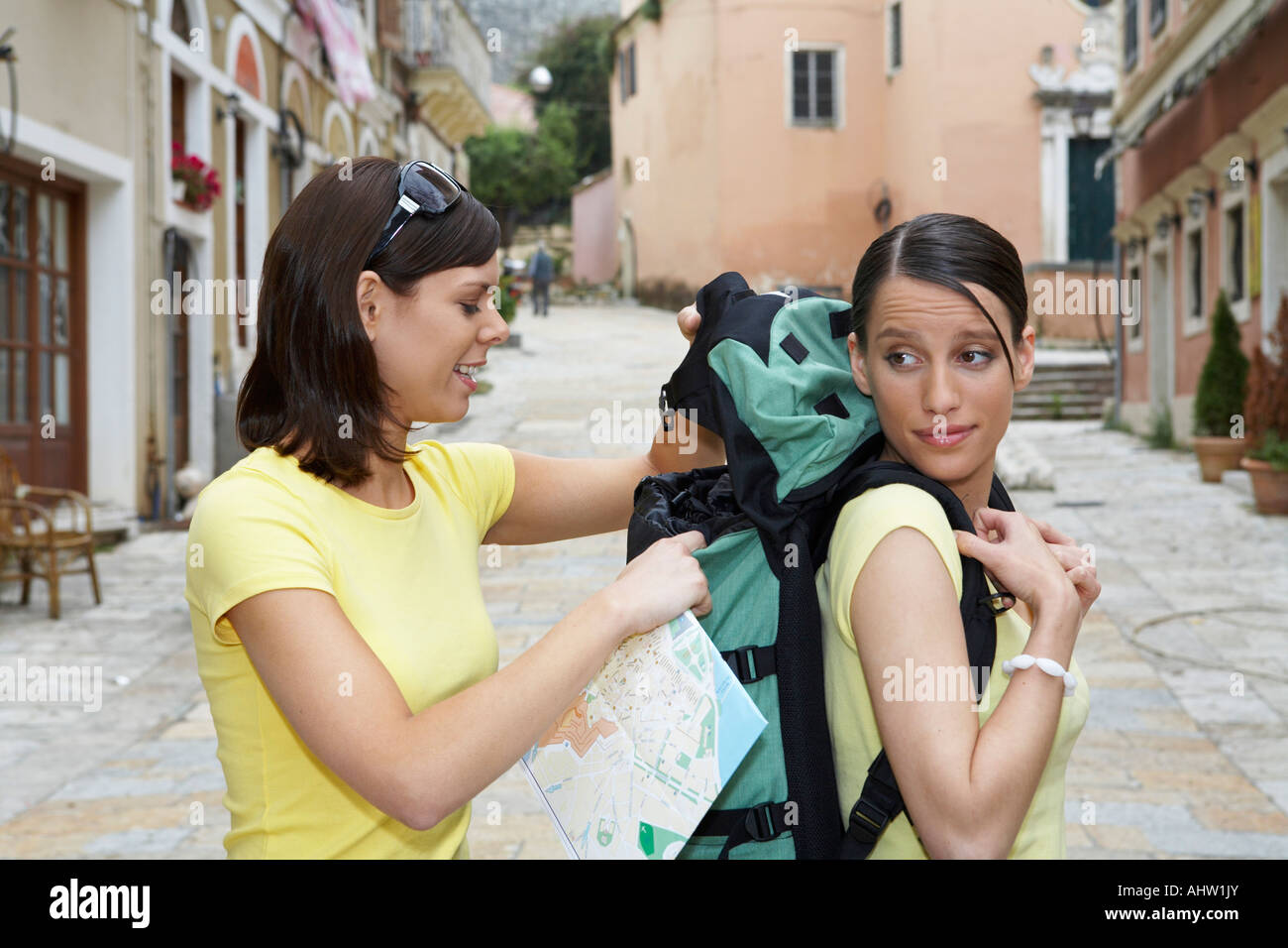 Two travelers in old city with map Stock Photo - Alamy