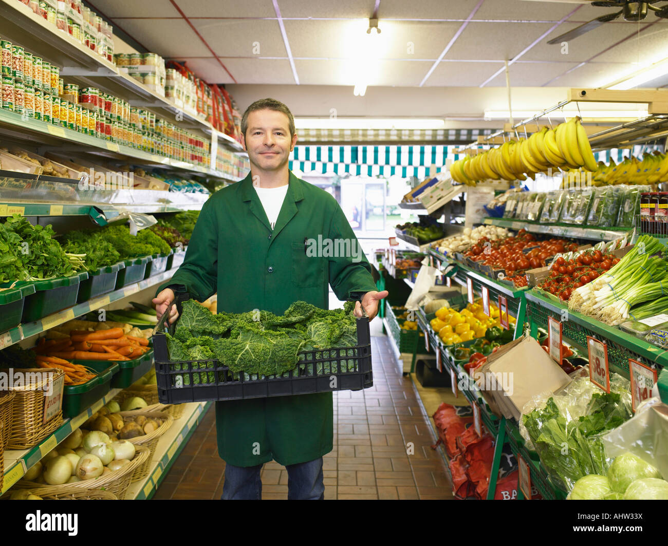 Grocer carrying some fresh vegetables Stock Photo - Alamy