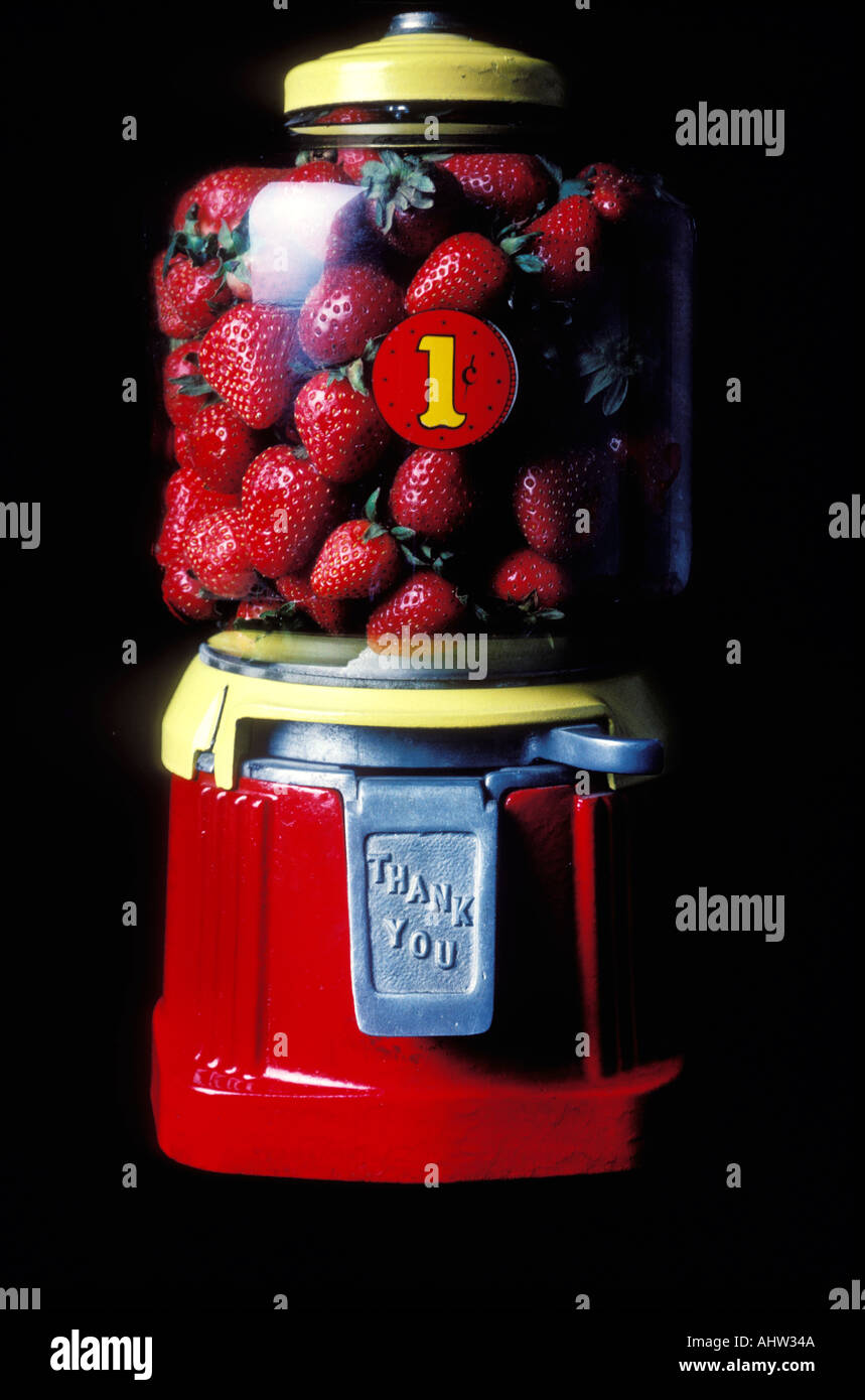 Gum machine filled with strawberry s Stock Photo - Alamy