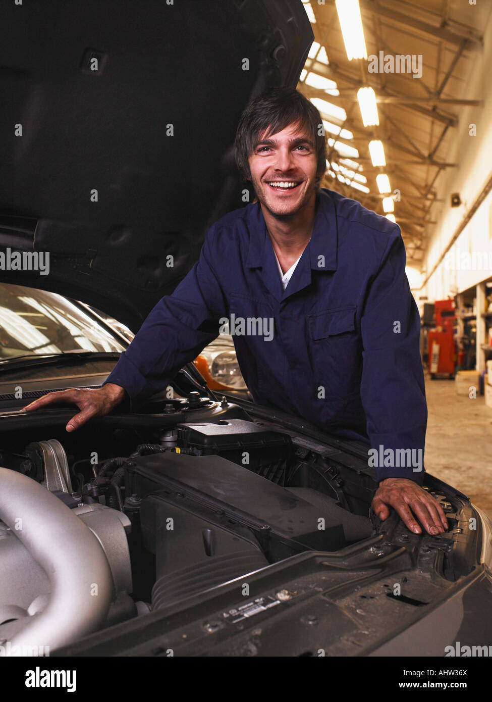 Mechanic working on an engine Stock Photo - Alamy