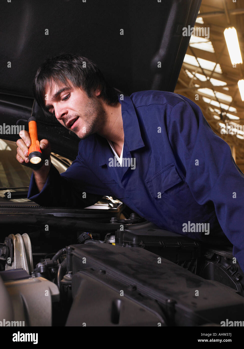 Mechanic working on an engine Stock Photo - Alamy