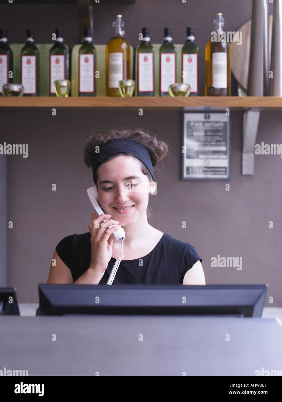 Hostess at her station in a restaurant Stock Photo - Alamy