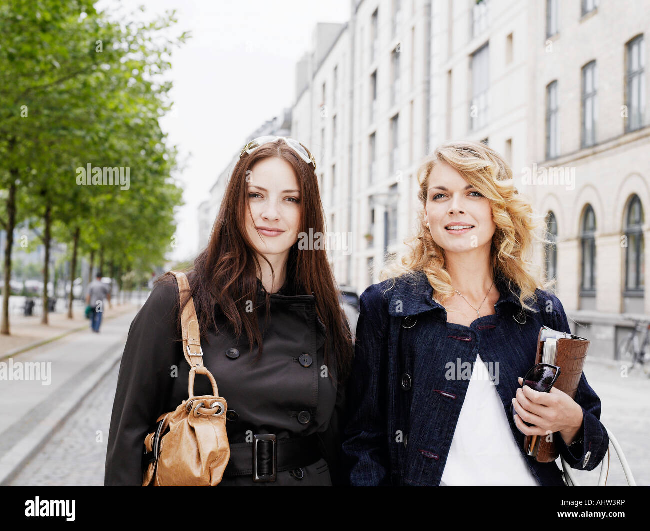 Two women walking outdoors Stock Photo - Alamy