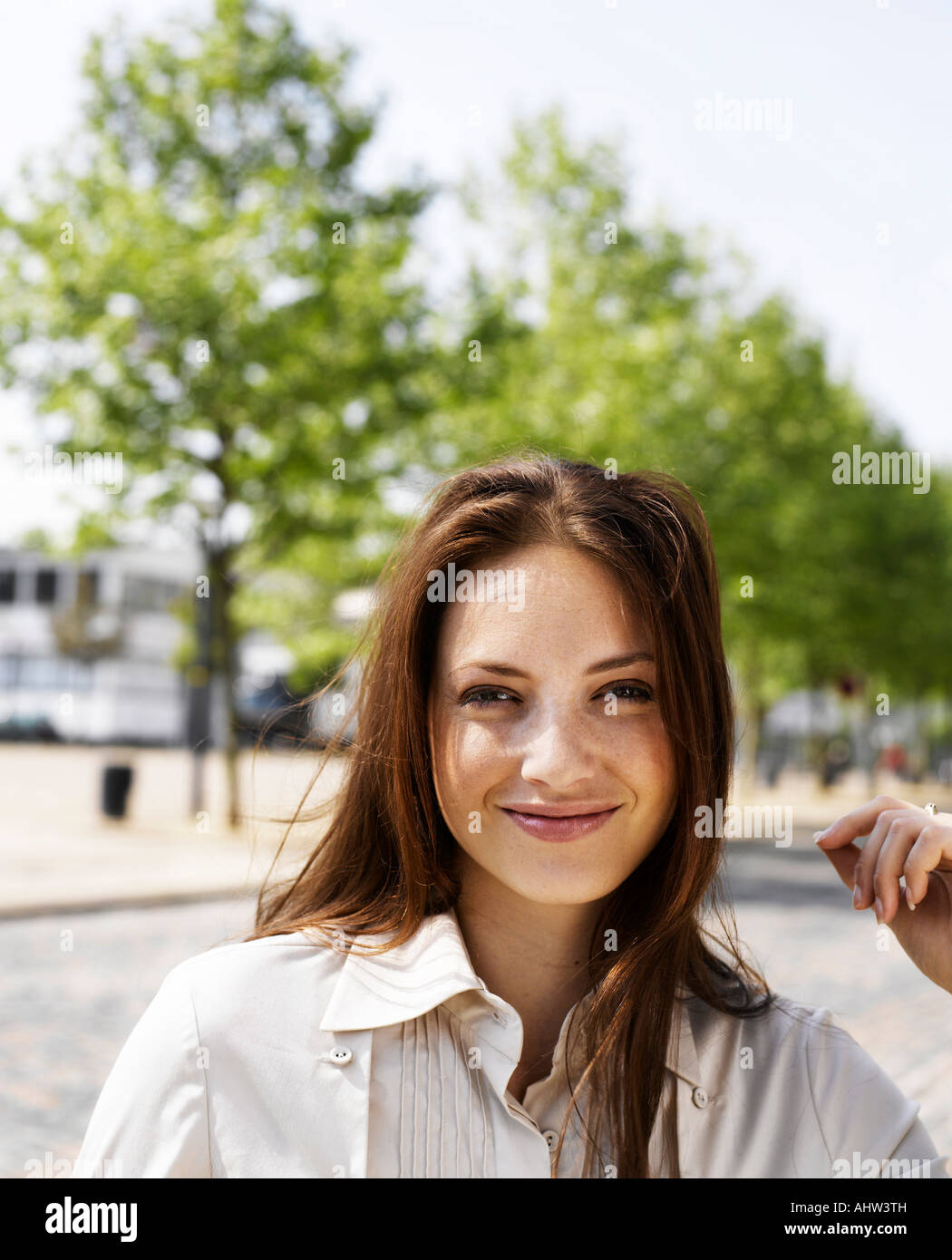 Woman standing outdoors Stock Photo - Alamy