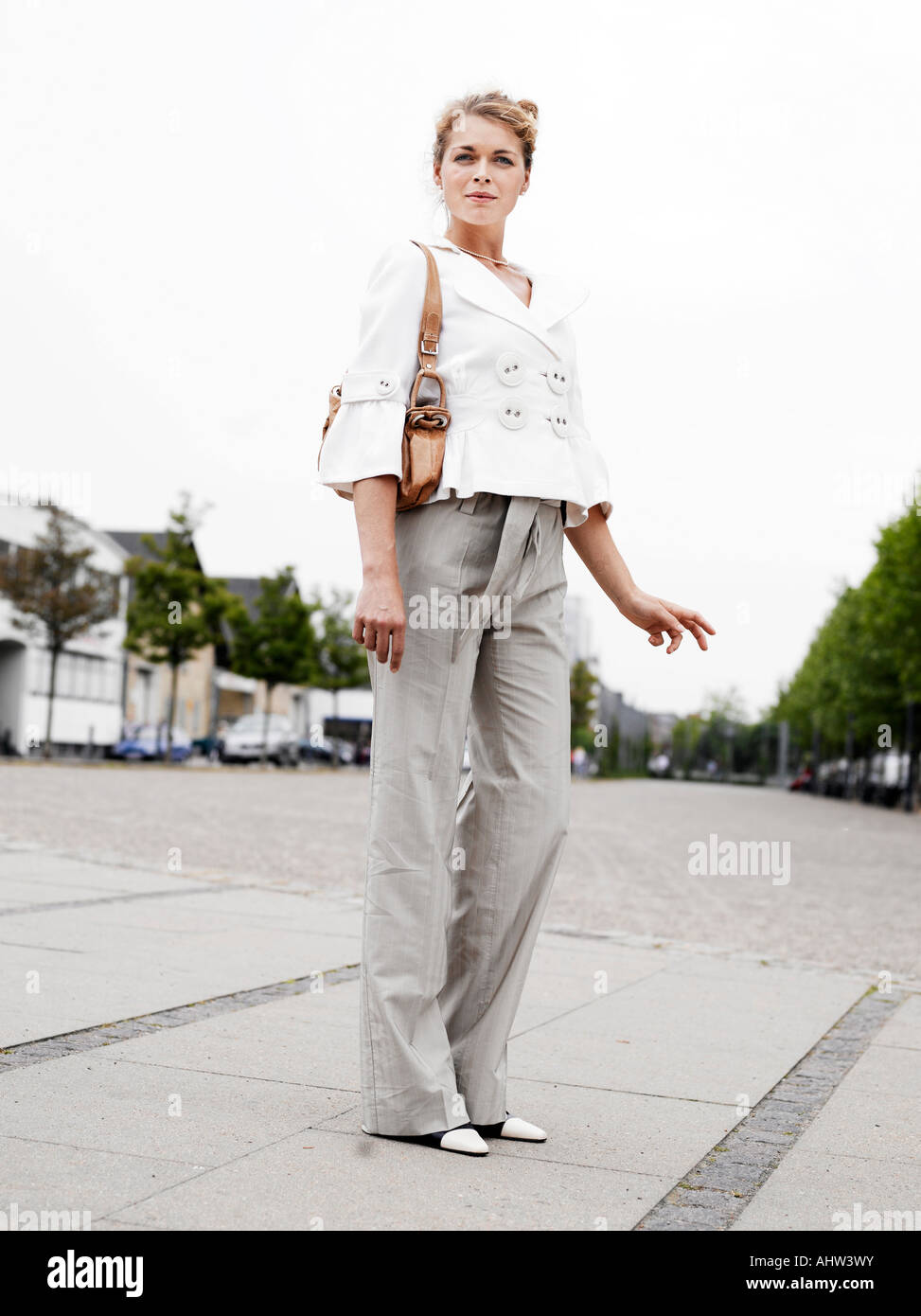Woman standing outdoors Stock Photo - Alamy
