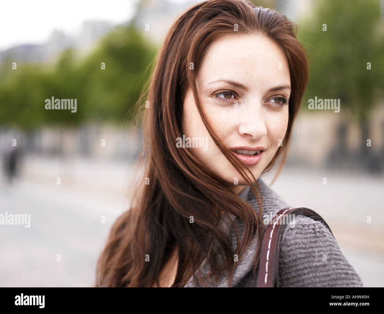 Woman standing outdoors Stock Photo - Alamy