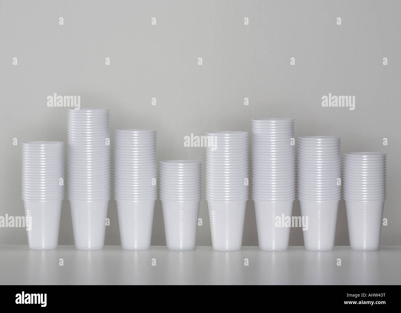 A line of piled up plastic cups Stock Photo - Alamy