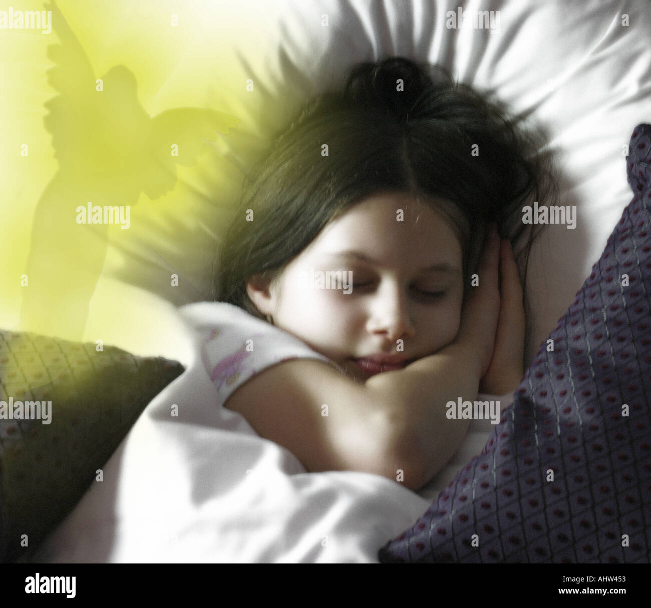 Young girl aged 10 asleep with her angel over her shoulder Stock Photo ...