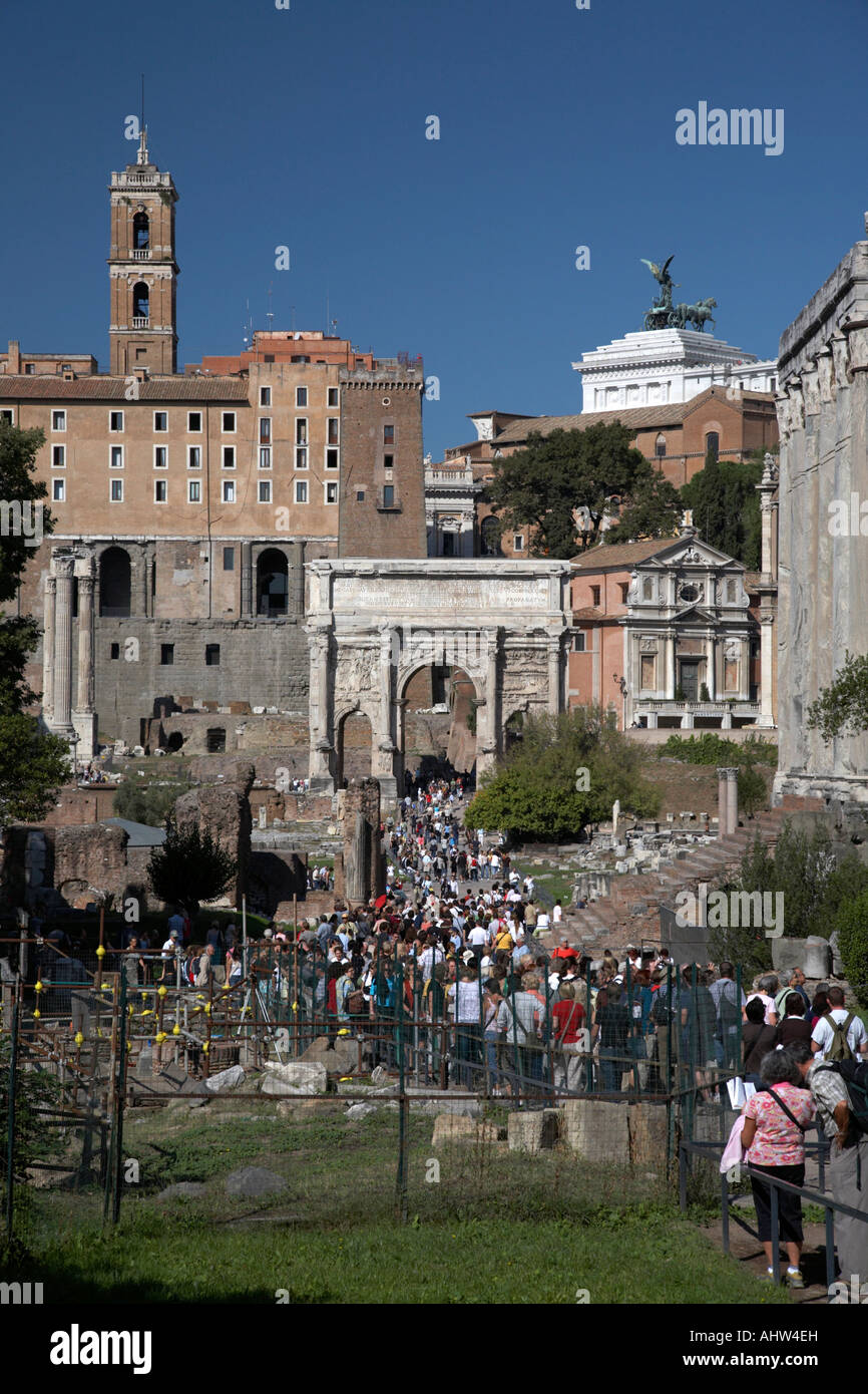 tourists stream through the centre of the Imperial roman Forum Rome ...