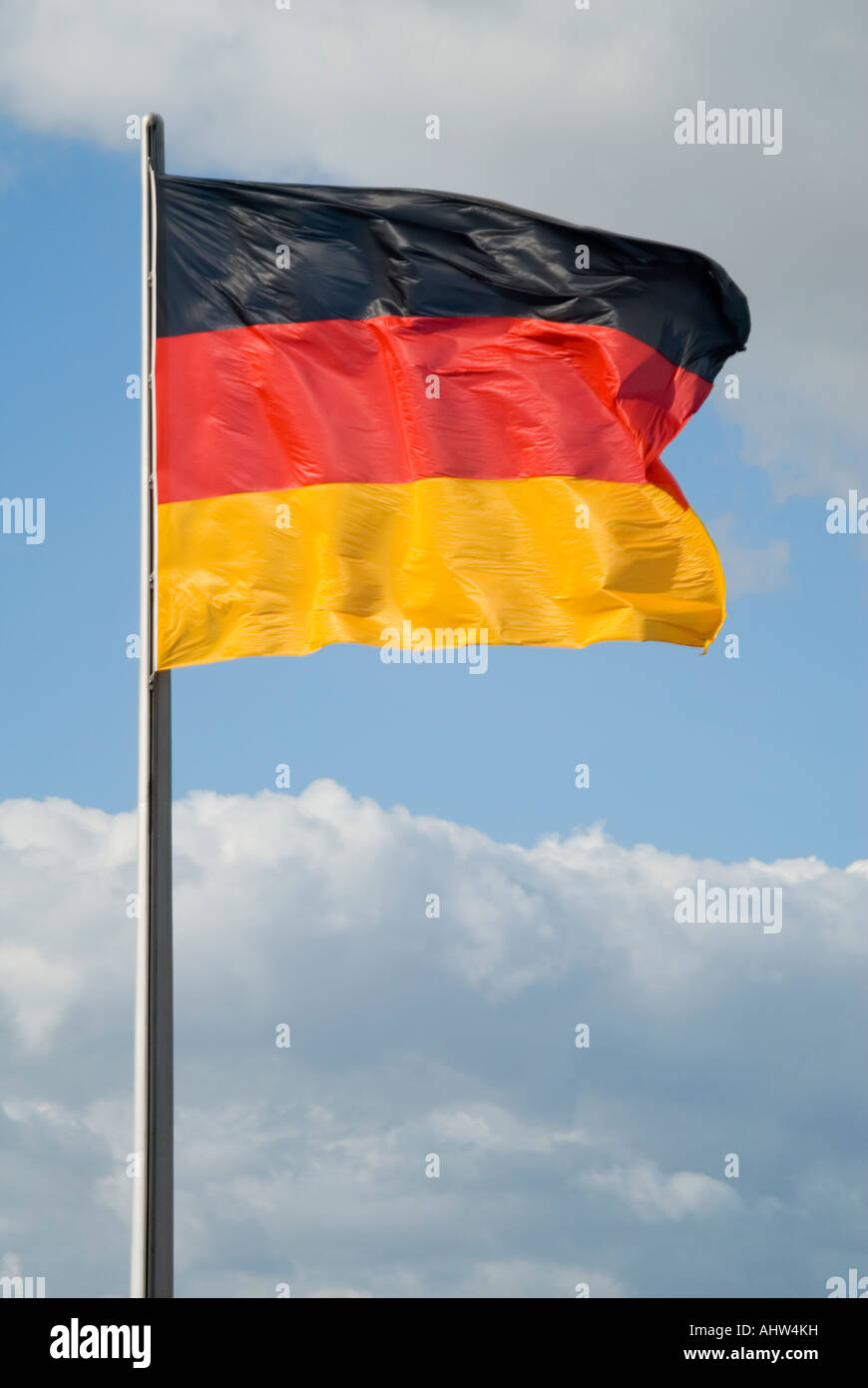 Vertical close up of the German flag 'Bundesflagge' at full mast on a ...