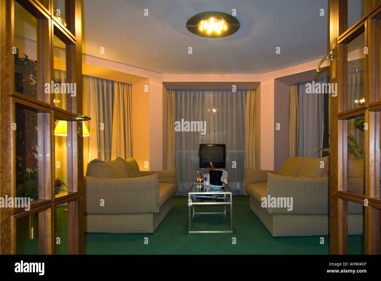 Horizontal wide angle of the living room in a suite of a high class ...