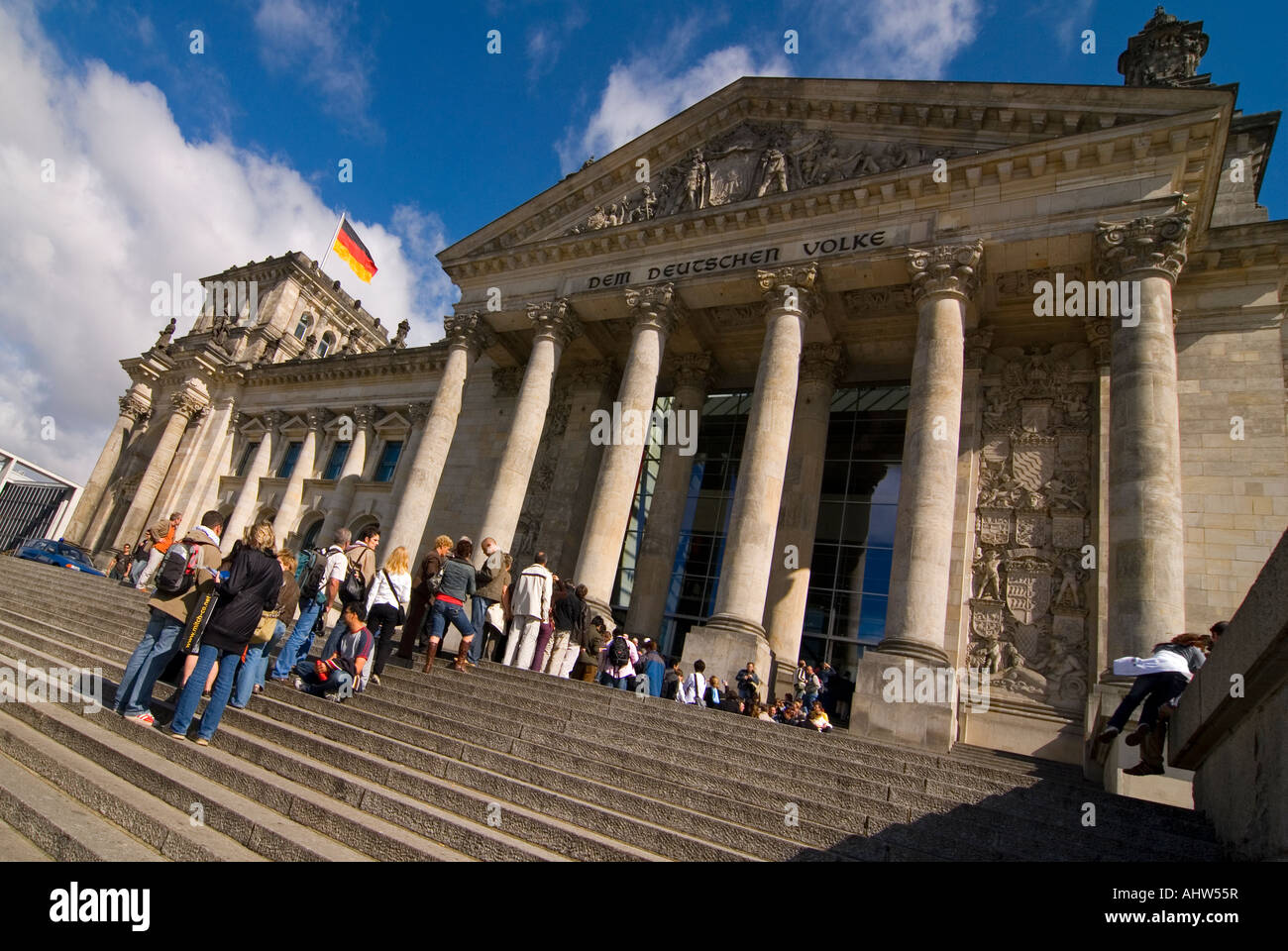 Horizontal wide angle of tourists queueing on the steps outside the ...