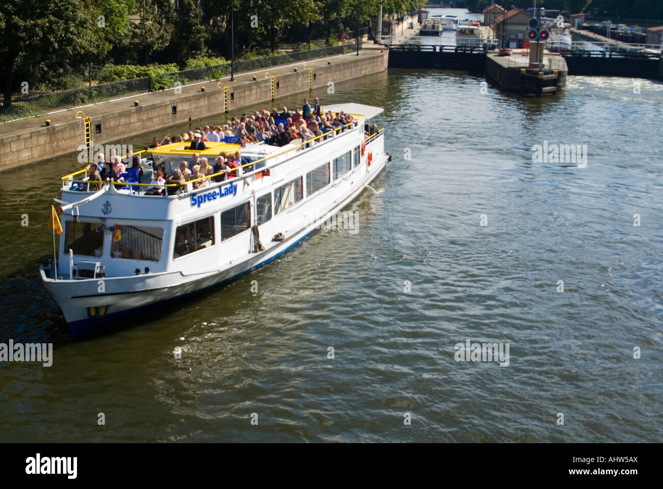 Horizontal aerial view of a boat tour on the river Spree with tourists ...