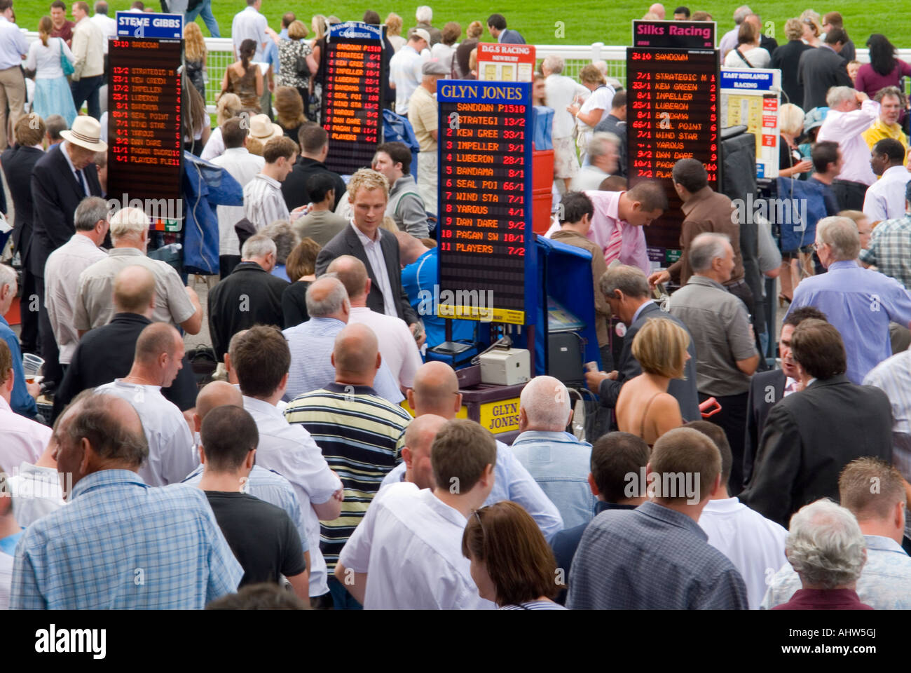 Horizontal view across the top of a crowd of people waiting to place ...
