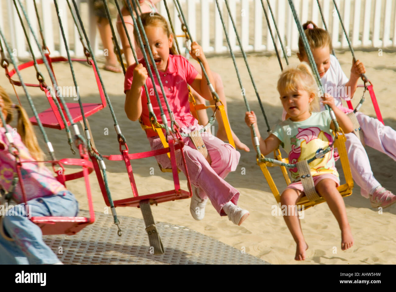 Children on swings hi-res stock photography and images - Alamy