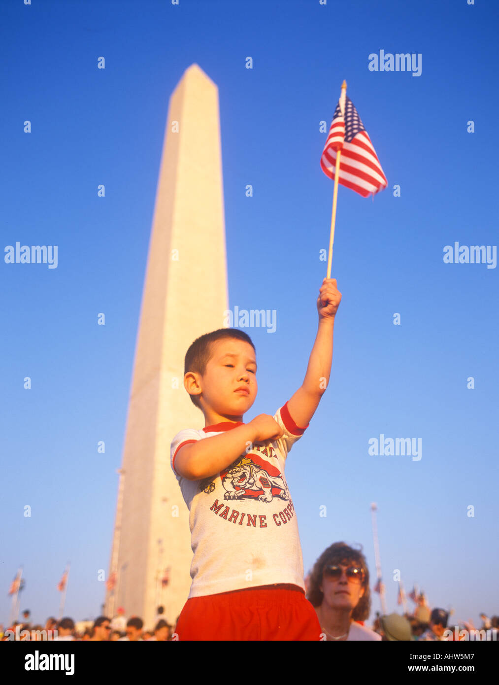 Child waving a miniature American flag at the Washington National ...