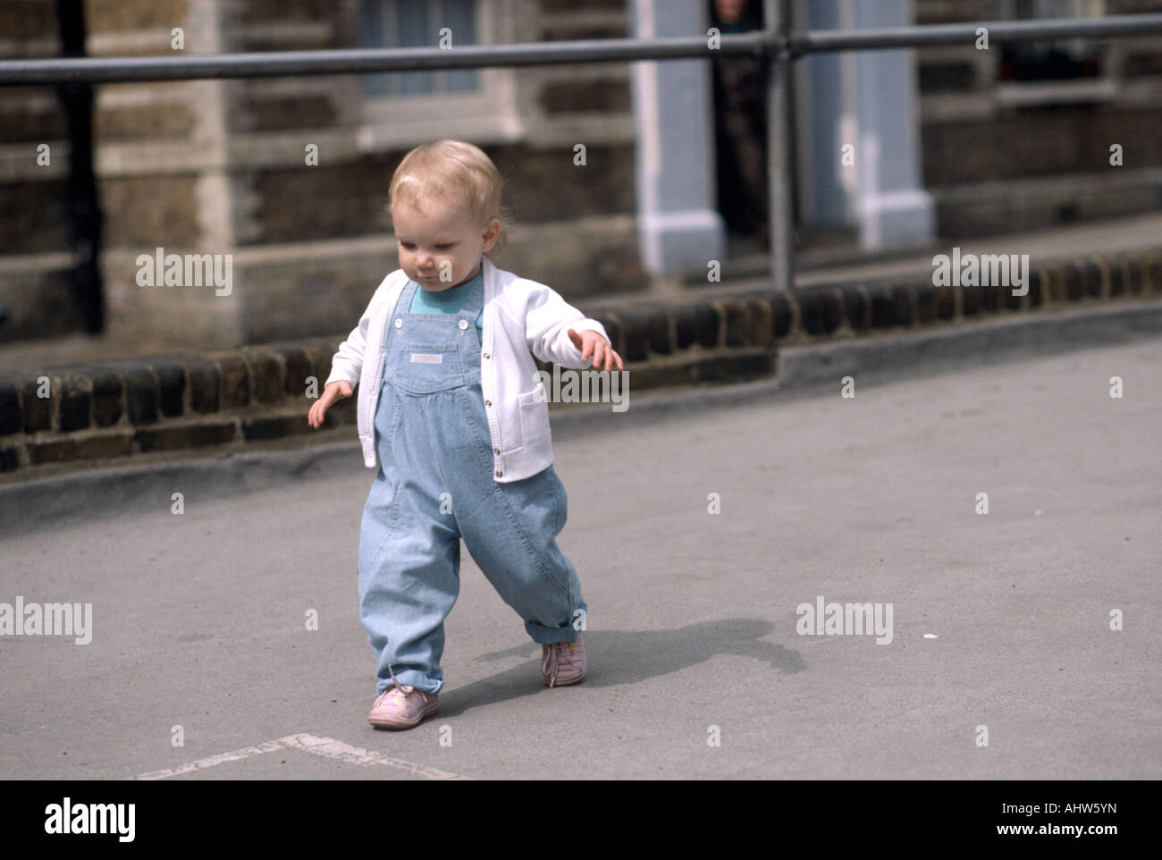 One year old girl taking her first run Stock Photo - Alamy