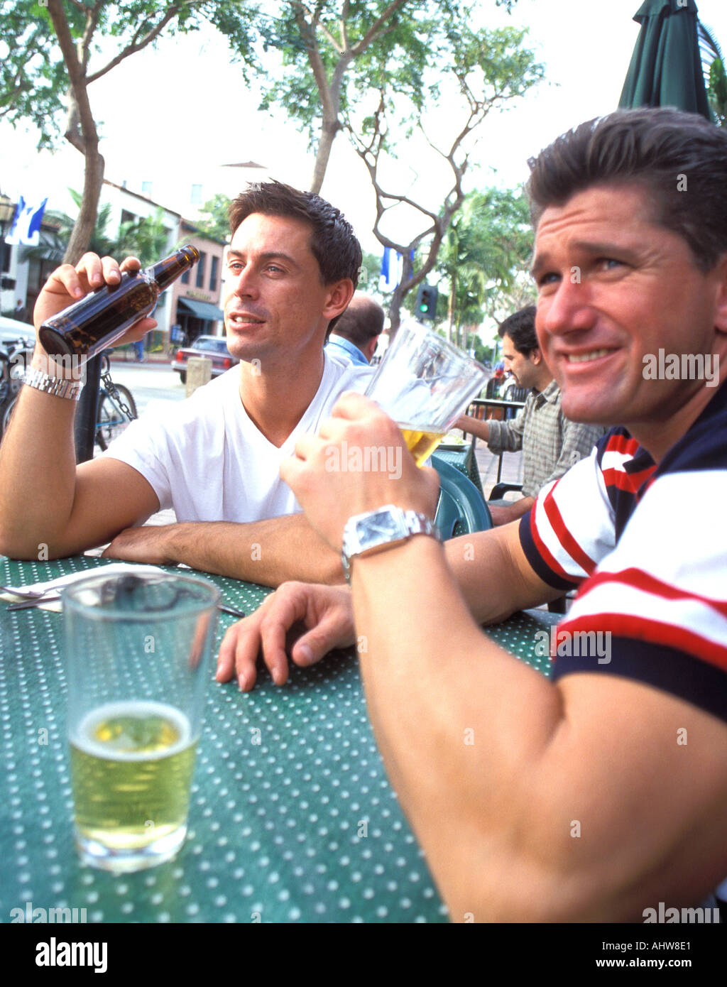 Two men drinking Stock Photo - Alamy