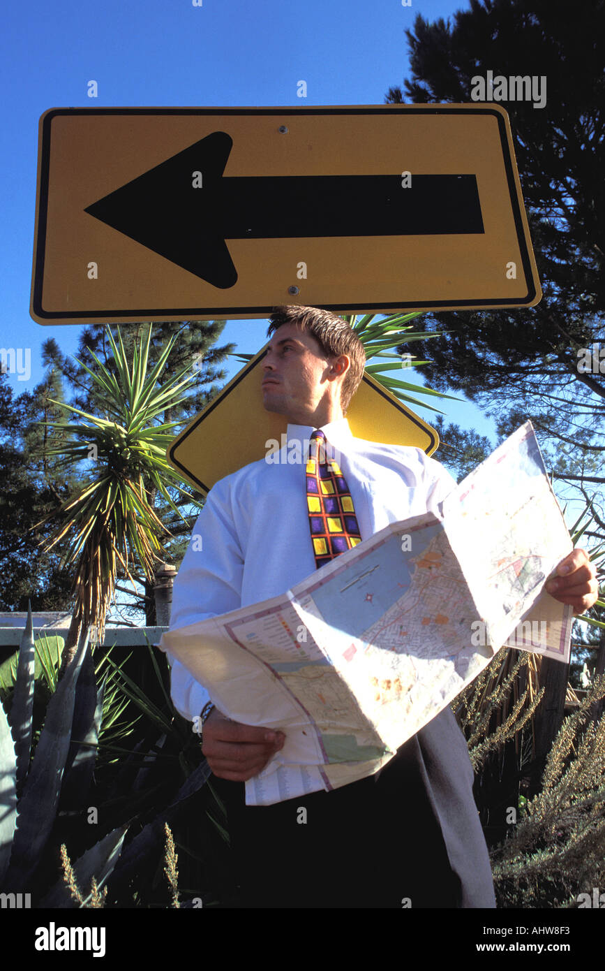 Man with map Stock Photo - Alamy